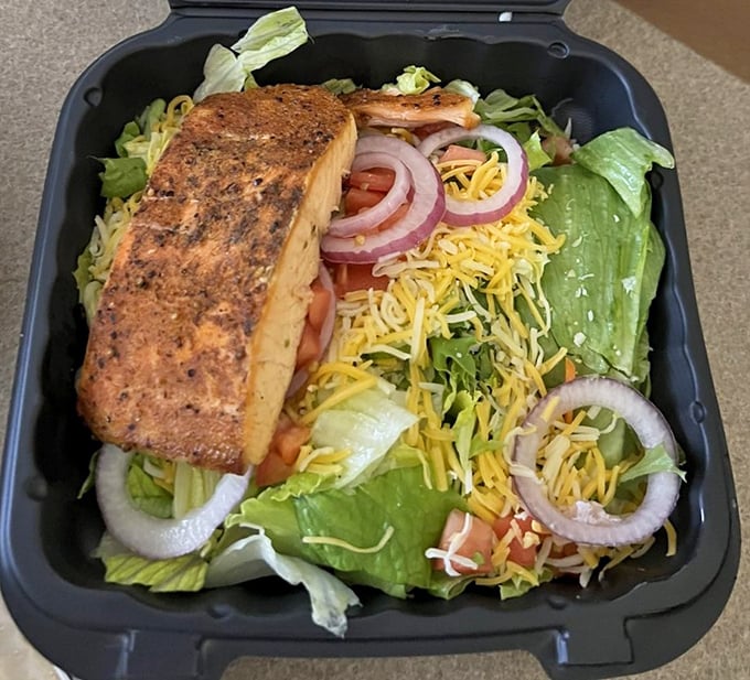 Fresh salad topped with house-smoked salmon &ndash; because even healthy choices deserve the royal treatment.