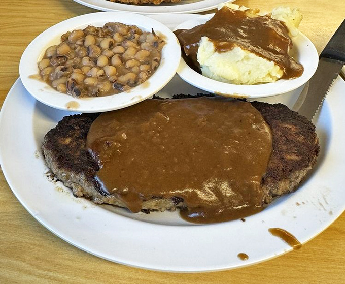 Salisbury steak that would make your grandmother proud, served with sides that complete this hearty comfort food symphony.
