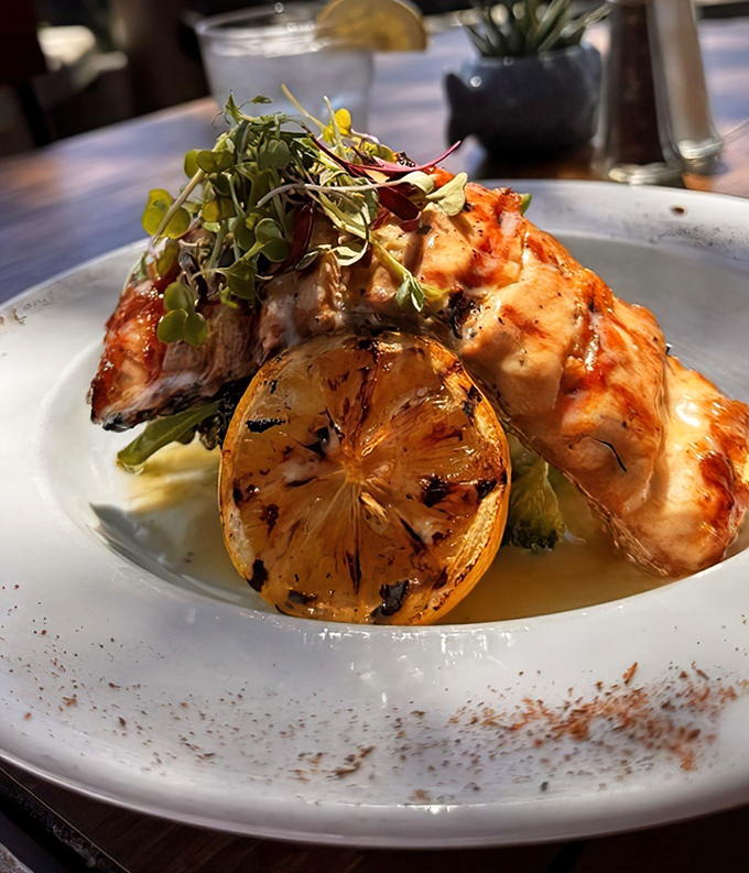 Salmon that clearly lived its best life before becoming the highlight of yours. That grilled lemon is the California sunshine on a plate.