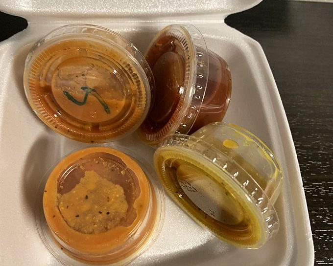 The sauce flight: because sometimes one flavor profile just isn't enough for your meat masterpiece. Each little cup holds liquid personality.