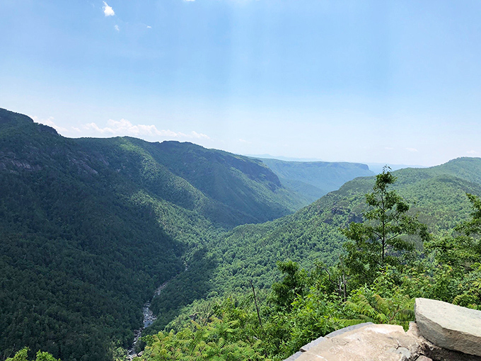 Sunbeams breaking through clouds create nature's spotlight on the gorge below&mdash;no filter needed for this kind of perfection.