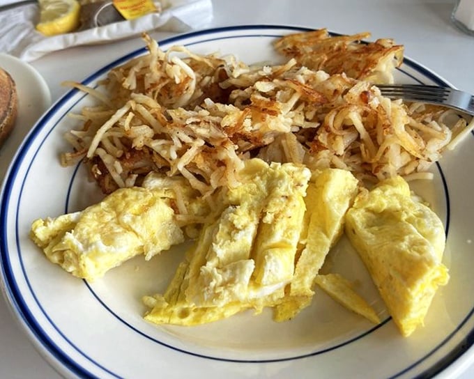 Scrambled eggs done right &ndash; actually fluffy, not just chopped up and abandoned. Paired with hash browns that crackle with each forkful of potato perfection.