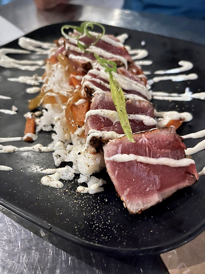 Seared tuna with artistic sauce work that makes you wonder: is this food or edible modern art?