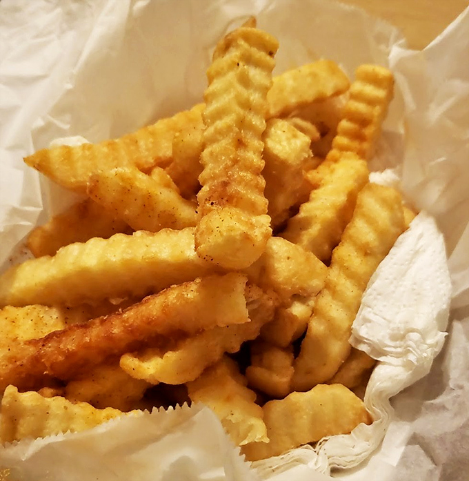 These aren't just fries&mdash;they're crispy, golden lifeboats in a sea of spice, offering momentary refuge between bites of fiery chicken.