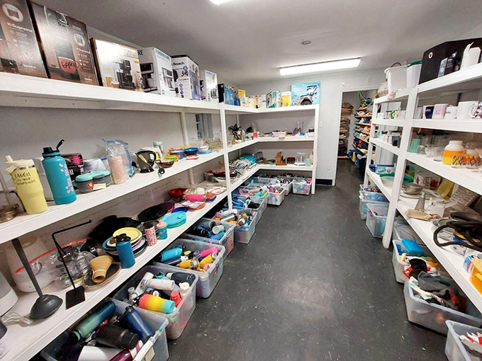 Organization is key in this thrifter's paradise, where plastic bins hold potential crafting supplies, home goods, and unexpected treasures.