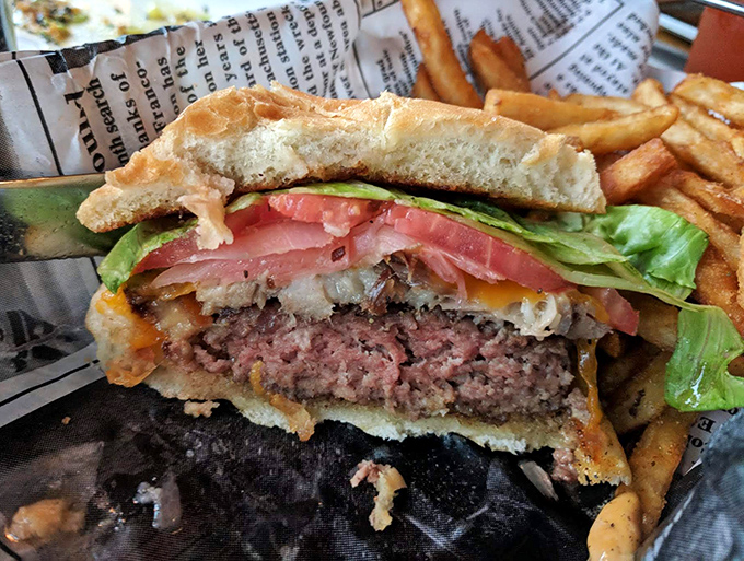 A burger that doesn't need to show off, but does anyway. That perfect medium-rare pink is nature's way of saying "You chose wisely."