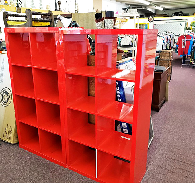 This fire-engine red shelf unit isn't just storage&mdash;it's a blank canvas waiting for your collection of quirky knickknacks or vintage vinyl.