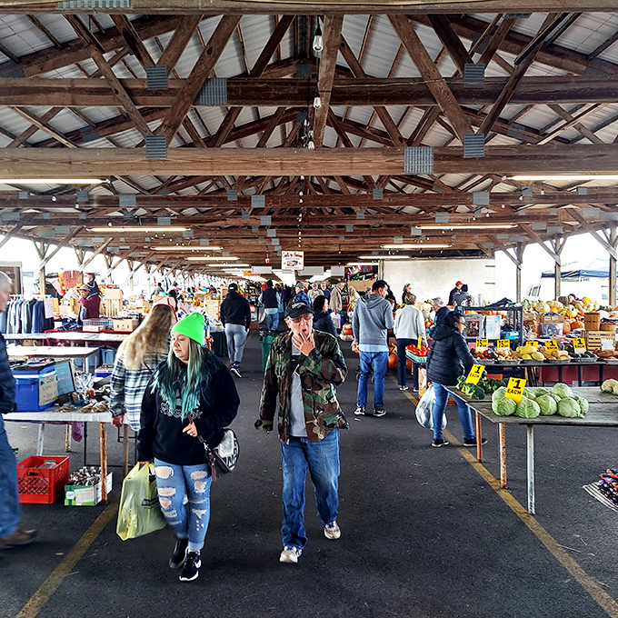 The market's bustling aisles where strangers become temporary shopping companions united in the quest for the perfect produce.