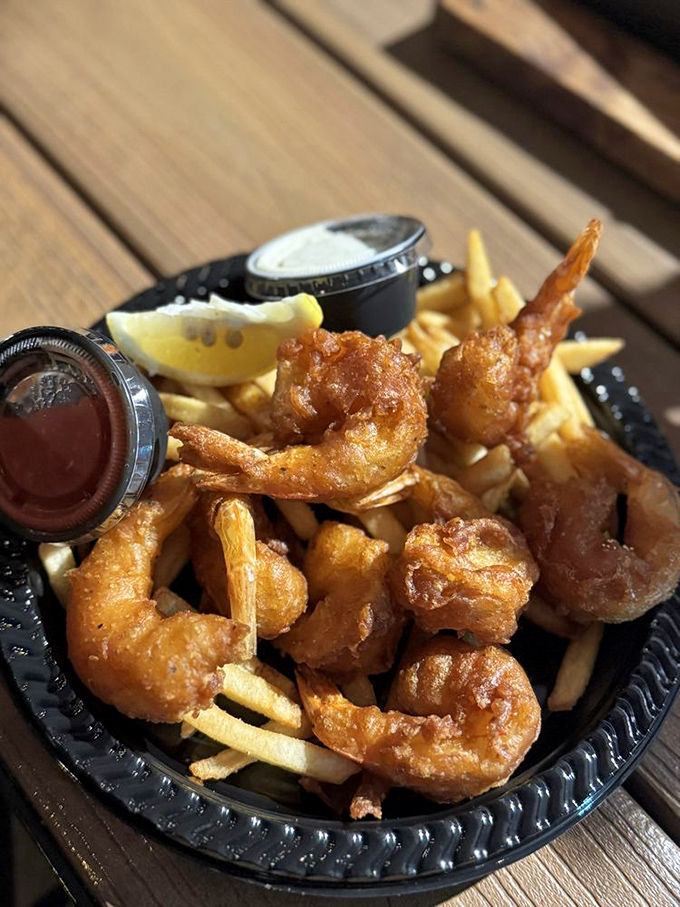 Crispy battered shrimp nestled among golden fries&mdash;the kind of comfort food that makes you want to hug the chef and the ocean.