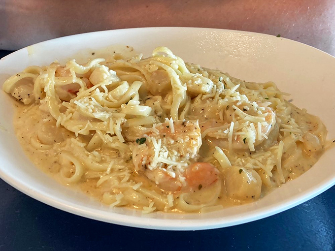 This Shrimp and Scallop Alfredo doesn't whisper, it announces itself. The pasta swimming in creamy sauce is like a seafood hug on a plate.