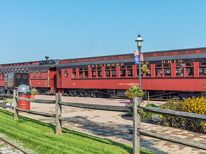 The Baltimore & Ohio passenger car gleams in the sunshine, its rich crimson exterior promising adventures that modern travel simply can't match.