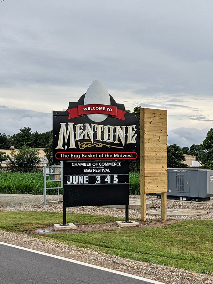 Mentone embraces its egg identity completely, with the town welcome sign featuring a mini-egg crown above its proud proclamation.