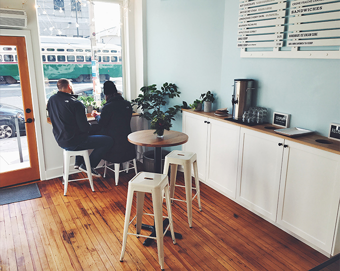 A cozy corner where strangers become friends, united by the universal language of exceptional ice cream.