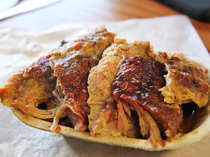 Sliced barbecue that shows off its smoke ring like a badge of honor. Each piece tells the story of patience, wood smoke, and barbecue wisdom.