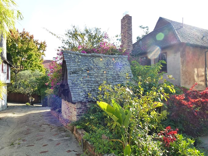This tiny structure looks like it was designed to house the village's smallest resident—perhaps a retired fairy godmother or a particularly sophisticated garden gnome.