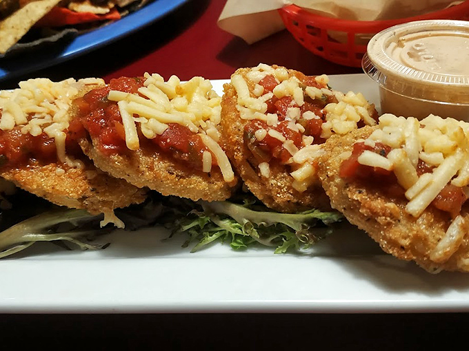 Fried green tomatoes wearing a coat of smoked Gouda like it's the season's hottest fashion—tangy, crispy, and utterly irresistible.