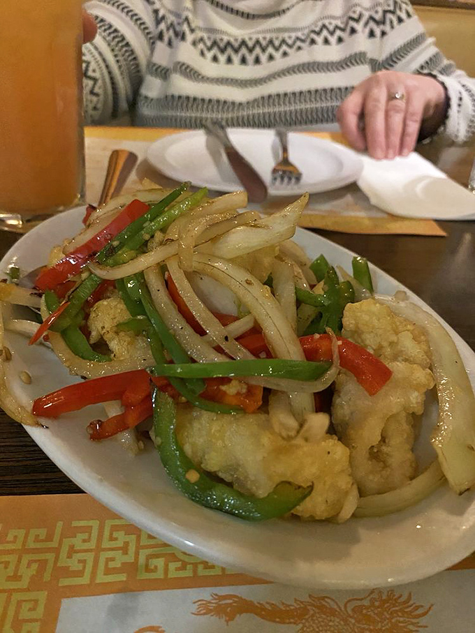 Salt and pepper calamari that's actually tender, not rubber bands in disguise. The peppers and onions add zip to every perfectly seasoned bite.