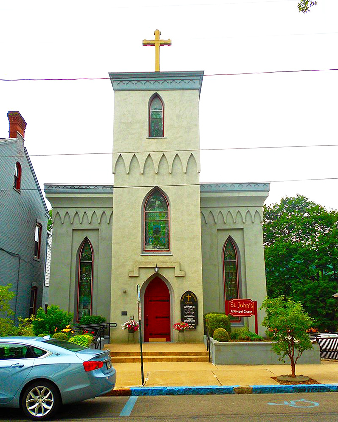 St. John's Episcopal Church brings Gothic charm to Huntingdon with its cream-colored walls, stained glass windows, and that unmistakable red door welcoming all.