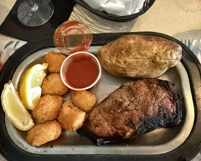 Steak, baked potato, and fried appetizers—the holy trinity of supper club dining presented on an unpretentious metal platter that means business.