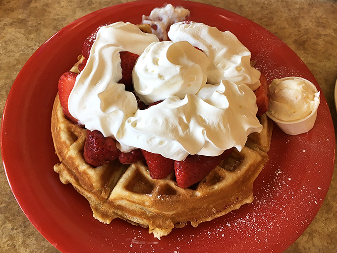 This waffle doesn't just carry strawberries and cream &ndash; it proudly displays them like jewelry on a red-plate runway. Breakfast or dessert? Yes.