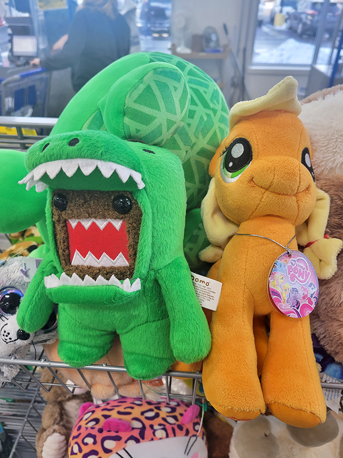 Domo in dinosaur costume meets My Little Pony: the stuffed toy aisle is where childhood dreams get a second chance.