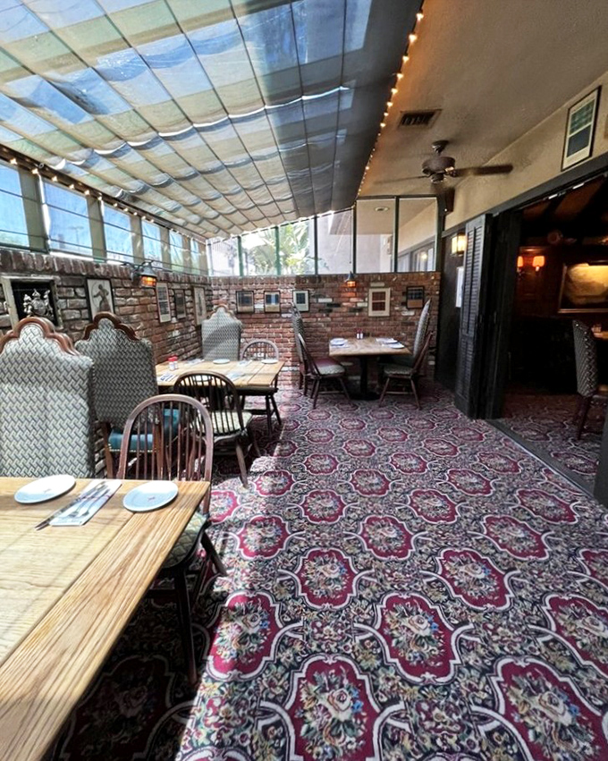 The sun room offers all the charm of eating outdoors with none of the sunburn—just dappled light filtering through to illuminate your feast.