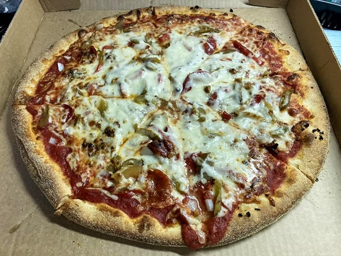 Sweet peppers add a complex layer to this already perfect pie. It's like pizza wearing its Sunday best without getting too fancy for its own good.