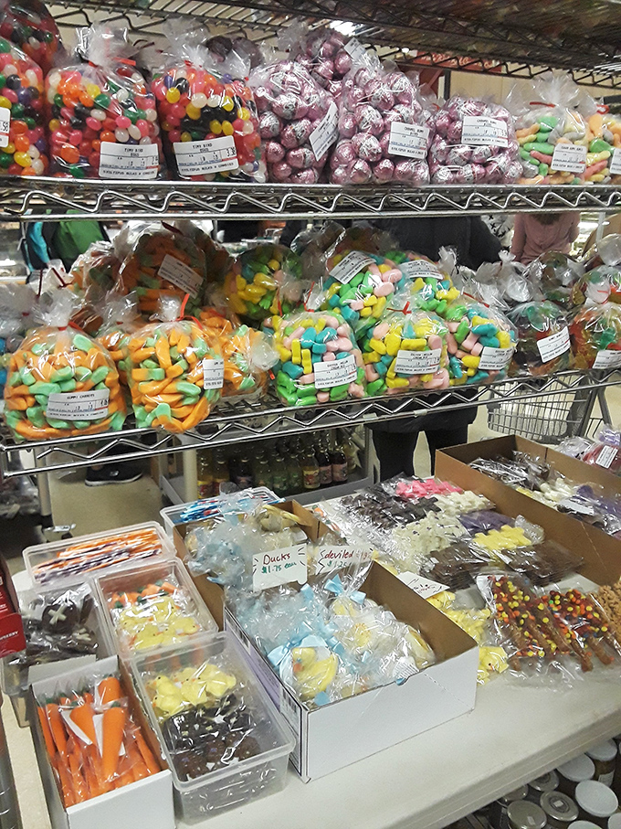 The candy section where childhood dreams and adult cravings collide in spectacular rainbow fashion.