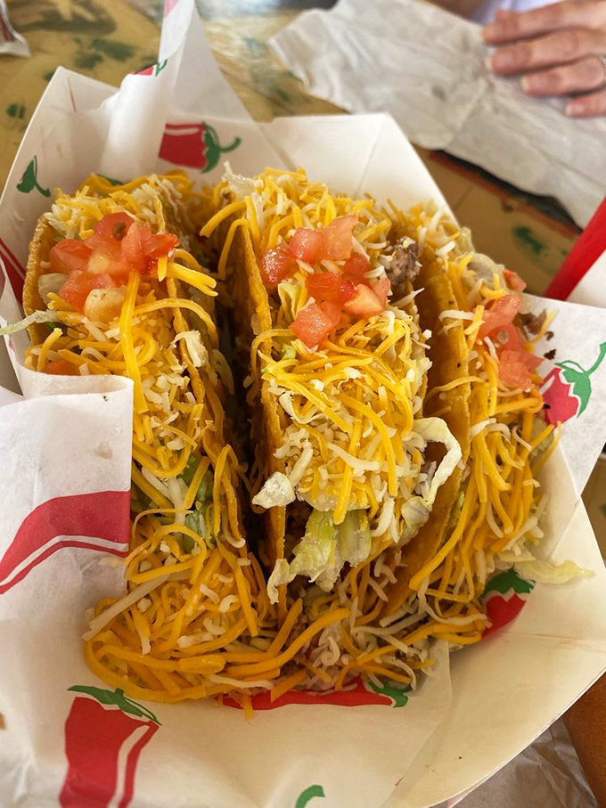 These tacos don't need to announce their authenticity&mdash;the generous heap of cheese and fresh tomatoes speaks volumes without saying a word.