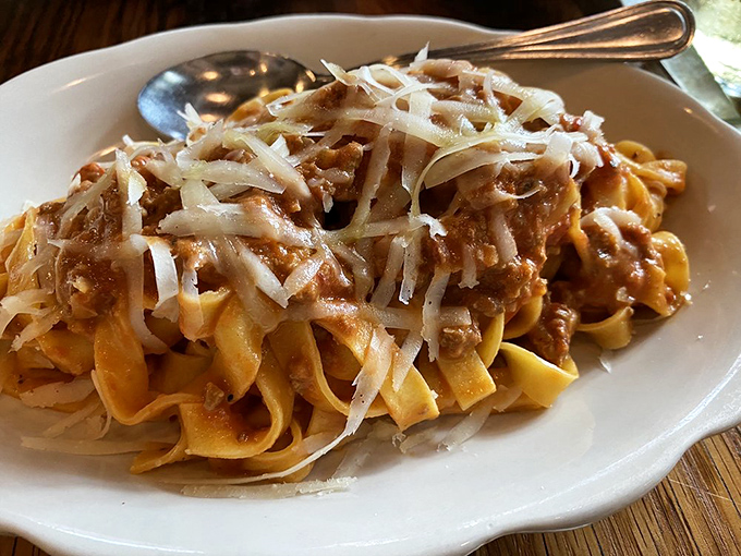 Tagliatelle Bolognese that doesn't hide behind excess sauce &ndash; just perfect pasta ribbons embracing a rich meat sauce in culinary harmony.