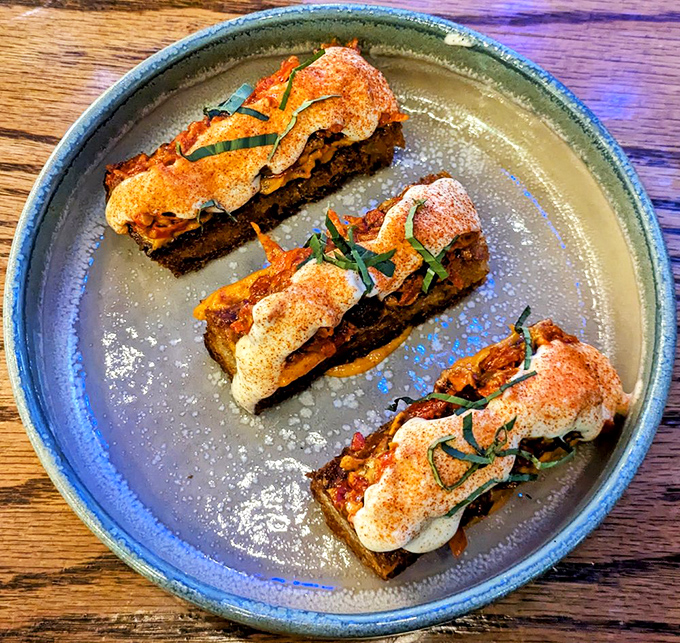 Three perfect bites of culinary craftsmanship. These elegant morsels showcase the kitchen's commitment to turning simple ingredients into memorable experiences.