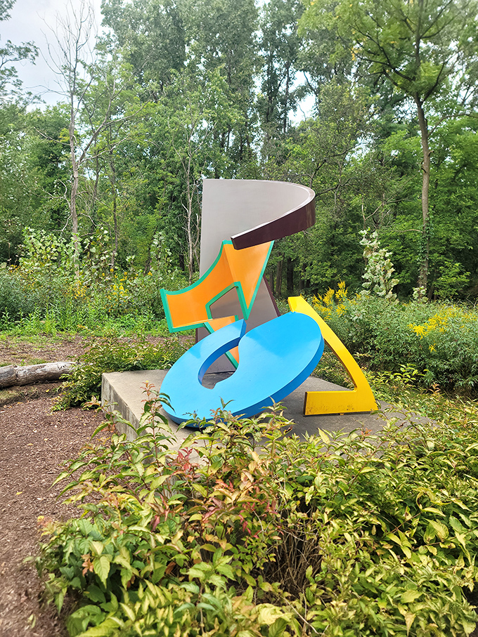 A riot of color erupts from the forest floor. This playful sculpture brings a Kandinsky painting to three-dimensional life.