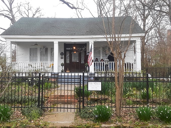 This charming cottage with its welcoming porch practically whispers "come sit a spell" in the most authentic Southern accent imaginable.