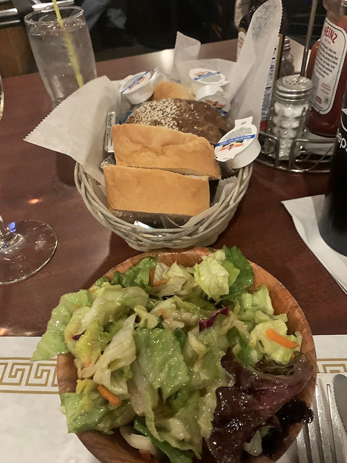 A wooden bowl of fresh salad and basket of bread&mdash;the opening act that knows its role in the barbecue symphony to follow.