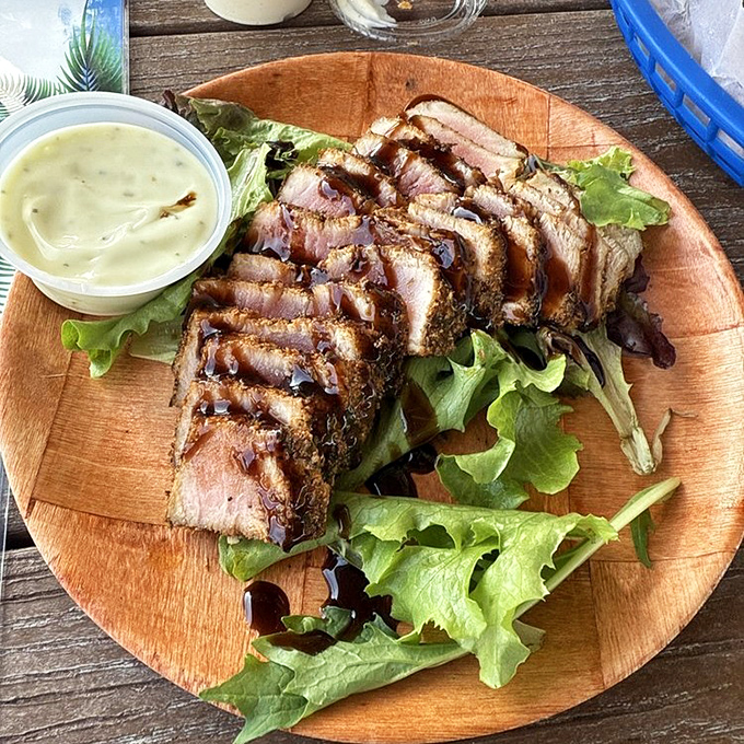 Seared tuna on a wooden plate—where "eating healthy" and "absolutely delicious" find their perfect intersection.