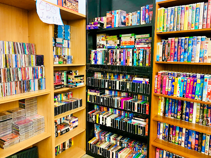 The VHS and DVD collection stands as a physical Netflix from another era, ready to transport you back to movie nights of yesteryear.