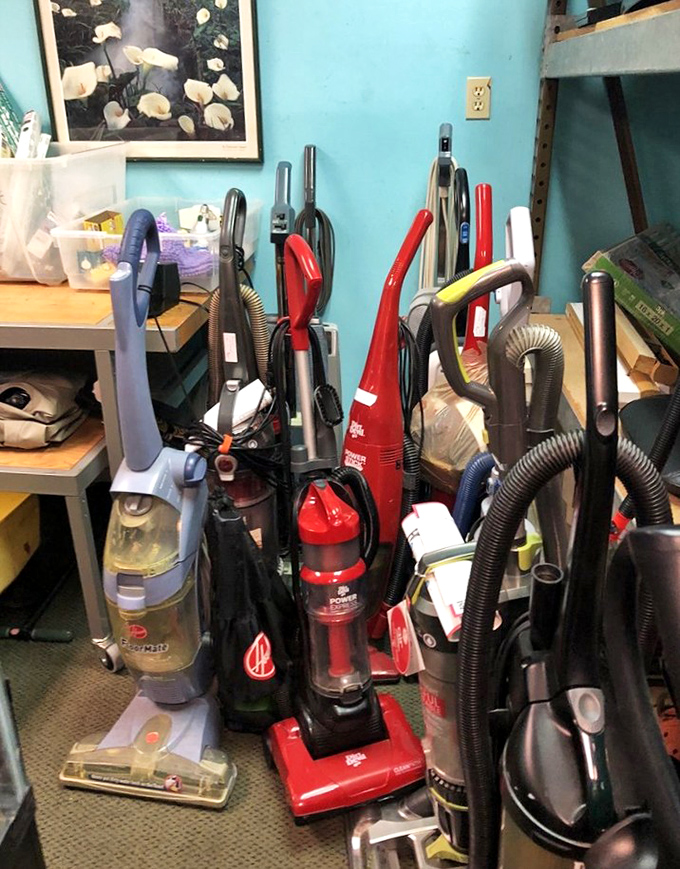 The vacuum cleaner lineup looks like a family reunion of cleaning devices spanning three generations. Each one still eager to suck up your living room's deepest secrets.