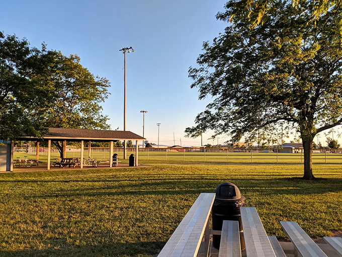 Golden hour transforms this simple park pavilion into a Norman Rockwell painting. The perfect spot for sunset picnics and watching the world slow down.
