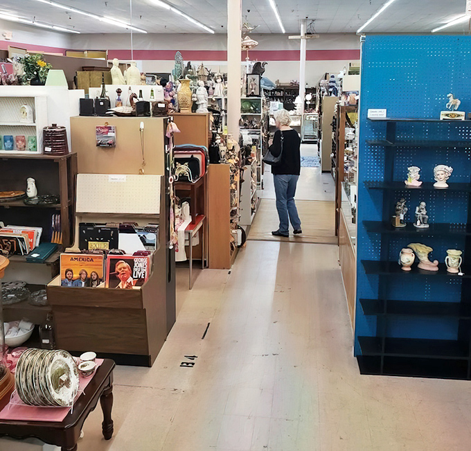 The quintessential antique mall experience &ndash; losing yourself in narrow aisles where every turn reveals something you suddenly "need."