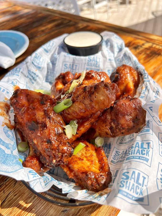 Wings that could make Buffalo jealous. Crispy, saucy, and garnished with green onions—proof that seafood restaurants can still nail the classics.