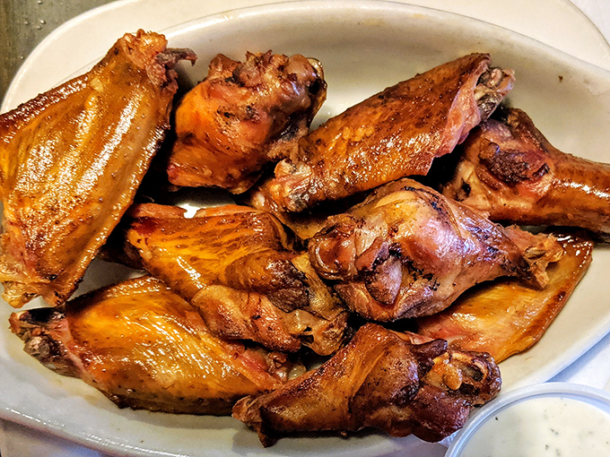Wings with a golden tan that would make George Hamilton jealous. Crispy, smoky, and ready for their close-up, these wings don't need a runway to make an impression.