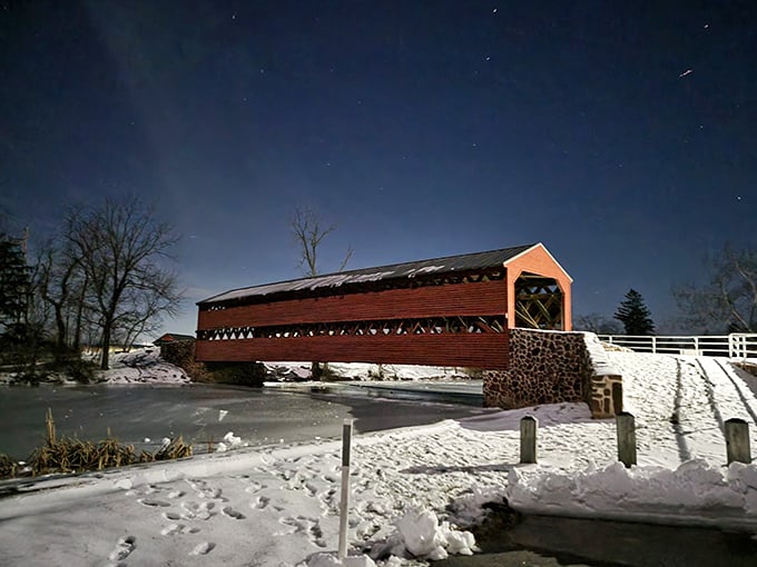 Under starlight, the bridge transforms into something magical&mdash;a crimson silhouette against the winter night that would make Norman Rockwell reach for his brushes.