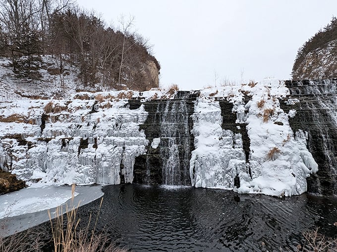 Winter transforms the falls into a frozen masterpiece. Like a pause button on nature, the ice captures movement in crystalline stillness.