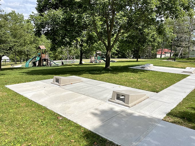 Woodland Park's memorial area offers a quiet space for reflection, where concrete foundations support both monuments and memories in equal measure.