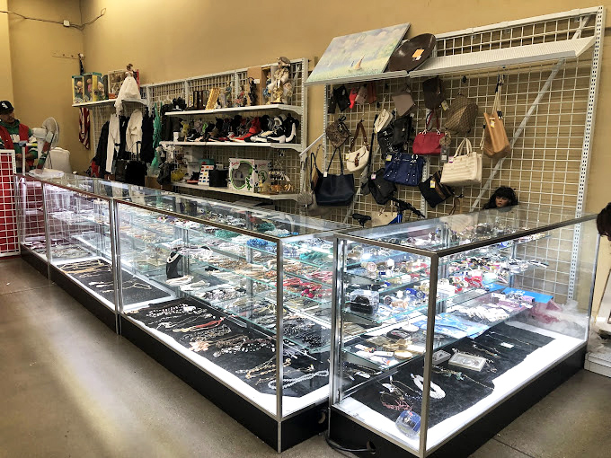 Glass jewelry cases sparkle with forgotten treasures, each piece holding secrets from previous owners' lives.