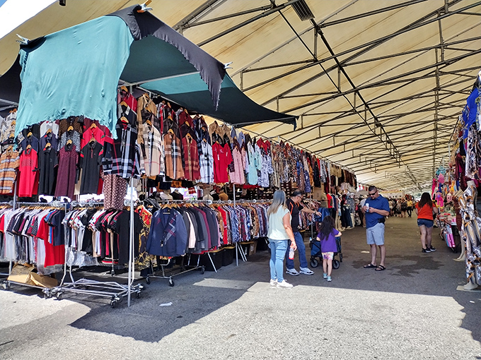 Racks of clothing create a textile rainbow, where fashion treasures hide between everyday basics, waiting for their perfect match.
