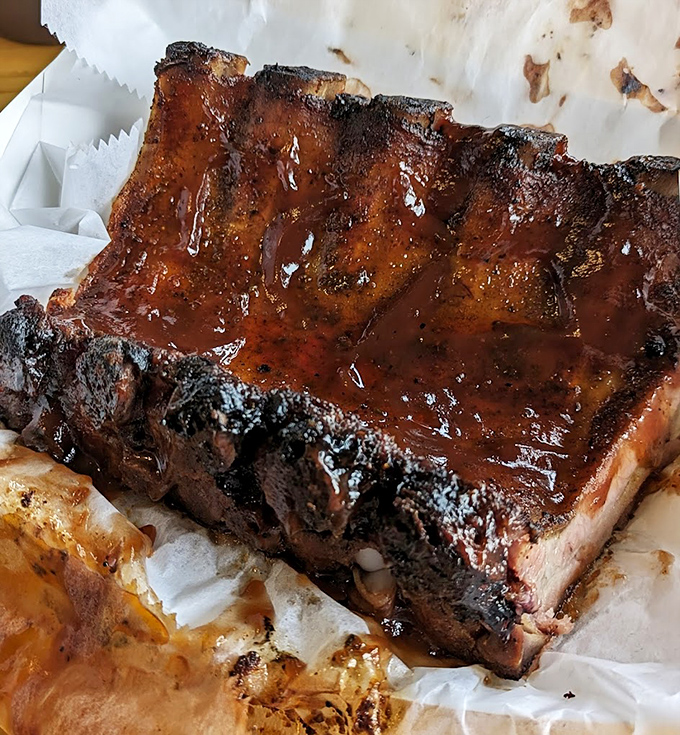 Ribs with a glaze so shiny you could practically check your reflection. That bark! That tenderness! That sauce!