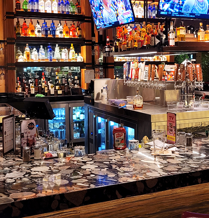 Bottles lined up like soldiers ready for duty. This impressive bar arsenal ensures your thirst will surrender without a fight.