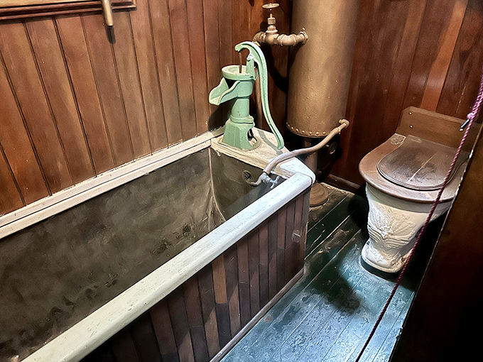 Indoor plumbing, 19th-century style! That hand pump and wooden bathtub make today's spa bathrooms seem almost boringly convenient by comparison.