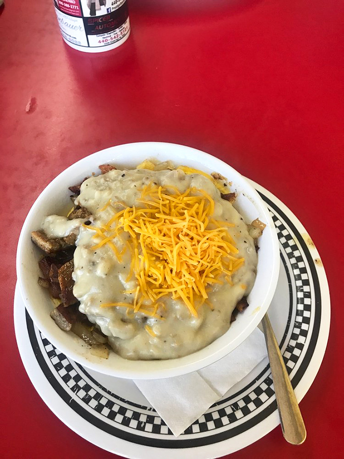 The breakfast bowl &ndash; where sausage gravy and cheddar create a magnificent summit atop a mountain of morning favorites.